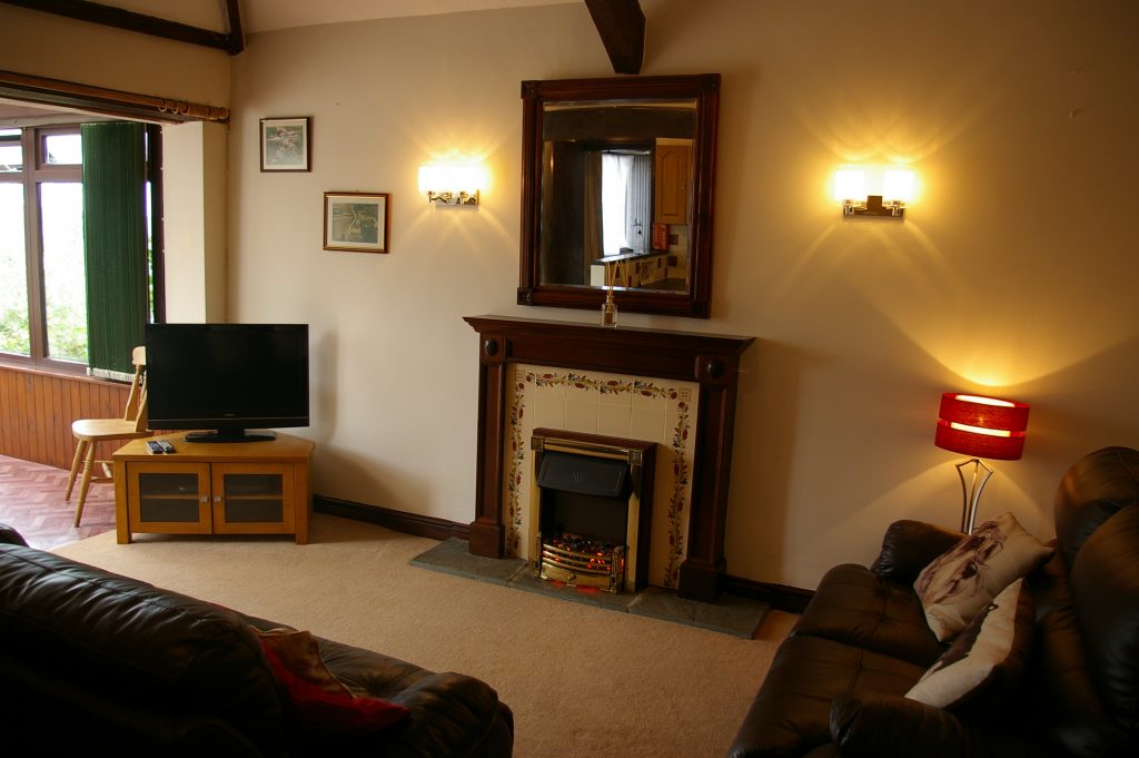 Folly Living Room With Fire - North Lee Farm Holiday Cottages